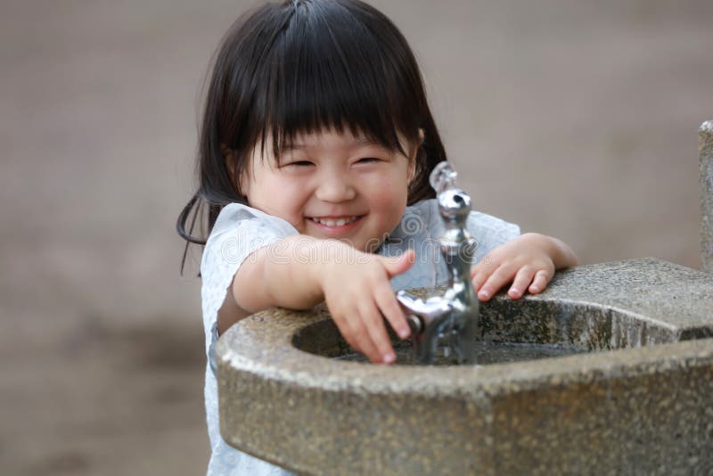 Girl giving water stock photo. Image of outdoor, children - 244458012