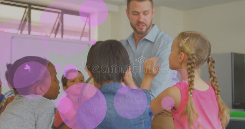 Image of Glowing Light Over Diverse School Children with Male Teacher in Classroom Stock Image ...