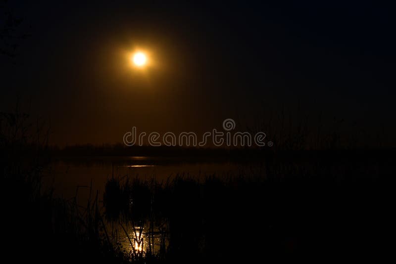 Glowing Full Moon Reflection Stock Image - Image of light, glowing ...