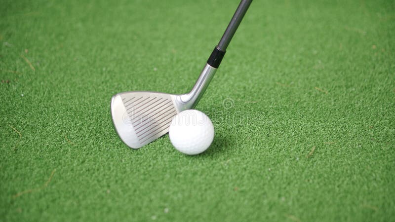 Image of Golf Iron or Club and Golf Ball on Green Grass Stock Photo ...