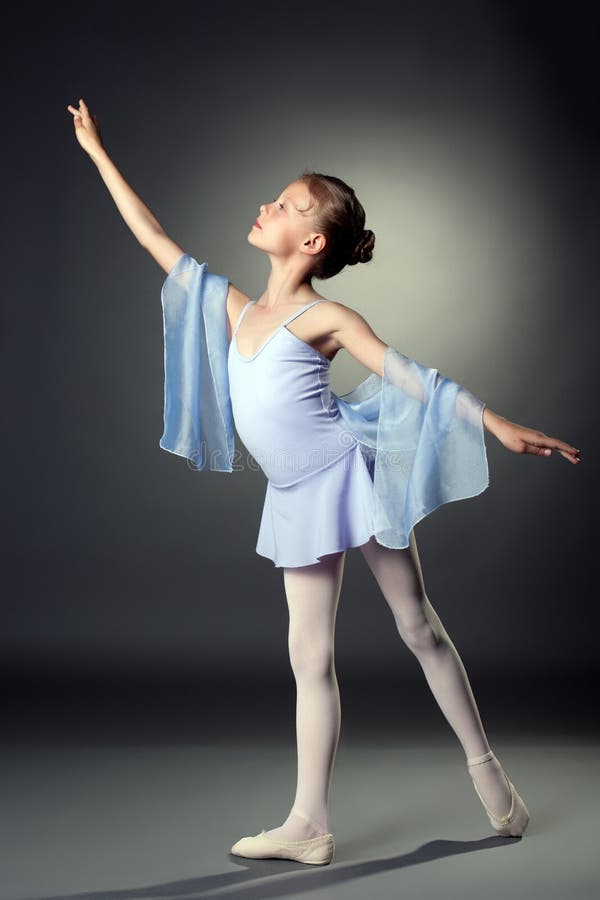 Image of Graceful Little Dancer on Gray Backdrop Stock Image - Image of ...
