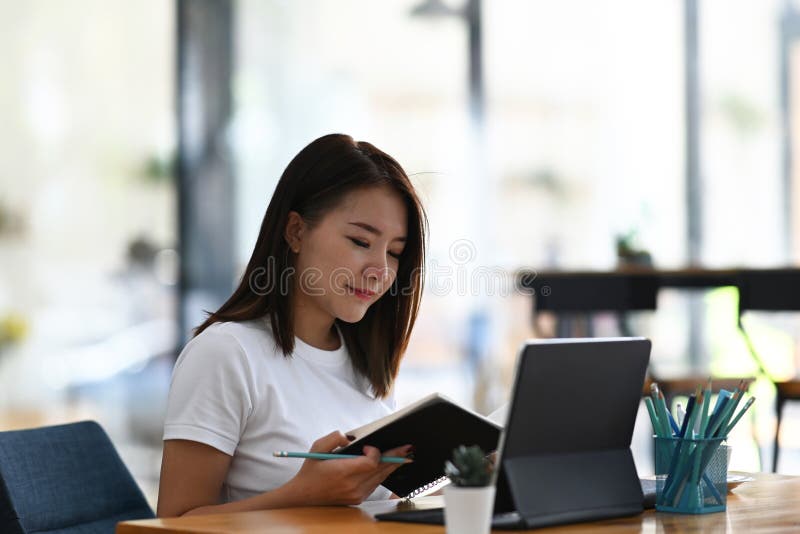 Image of Graphic Designer Woman Working with Tablet Computer and ...