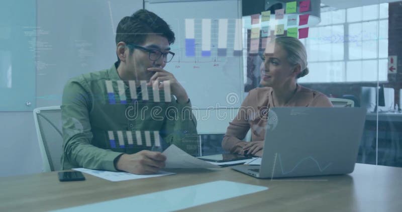 Image of Graphs and Globes Over Diverse Coworkers Discussing Reports on ...