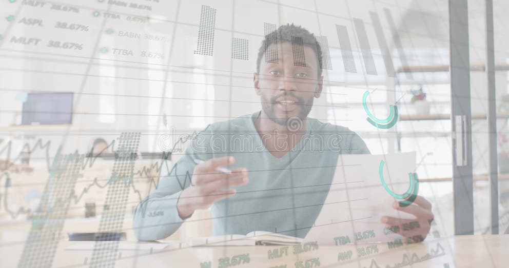 Image of Graphs, Trading Board, Biracial Man Writing in Notepad ...