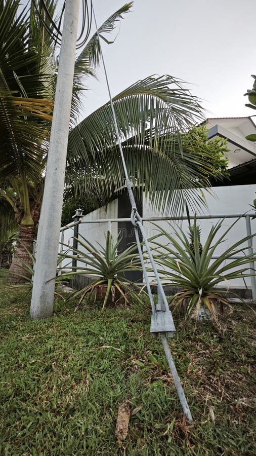 Guy Anchor Wire Balancing the Electric Pole by the Roadside. Stock ...