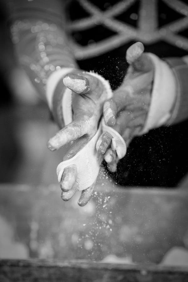 Image of a Gymnast Dusting Their Hands with Chalk before a Performance ...