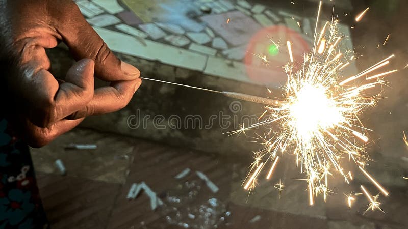 Human Holding a Sparkling Cracker that Was Releasing Fire Stock Image ...