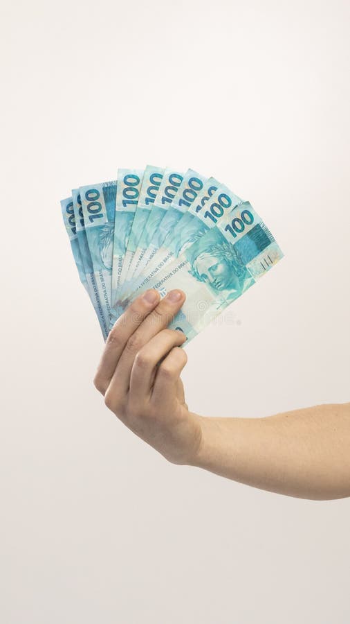 Image of a Hand Holding R$100 Bills Stock Photo - Image of r100 ...
