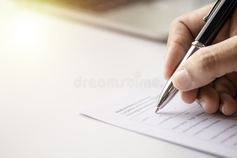 Image of Hand Using Writing Pen with Questionnaire or Paperwork Survey ...