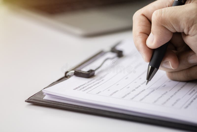 Image of Hand Using Writing Pen with Questionnaire or Paperwork Survey ...