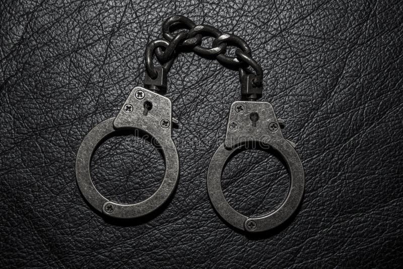 Image of Handcuffs Leather Background Stock Photo - Image of police ...