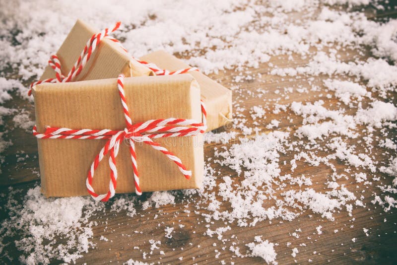 Image of Handmade Gift Boxes Over Snowy Wooden Table Stock Photo ...
