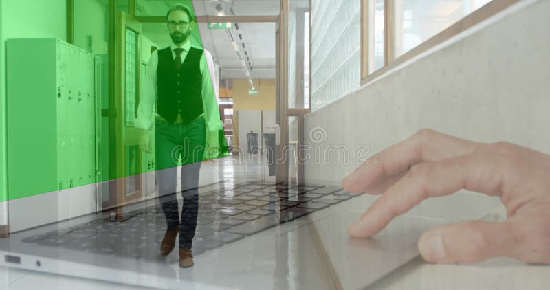 Image of Hands Using Laptop Over Businessman Walking in Office Corridor ...