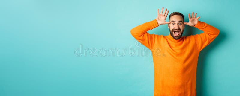 Image of Handsome Caucasian Man Making Funny Faces, Mocking Someone and ...