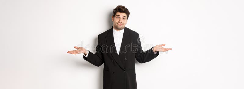 Image of Handsome Confused Man in Black Suit, Shrugging and Looking ...