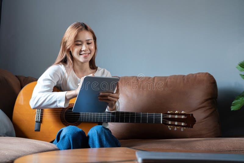 Image of Happy Beautiful Woman Playing Guitar and Composing Song Stock ...