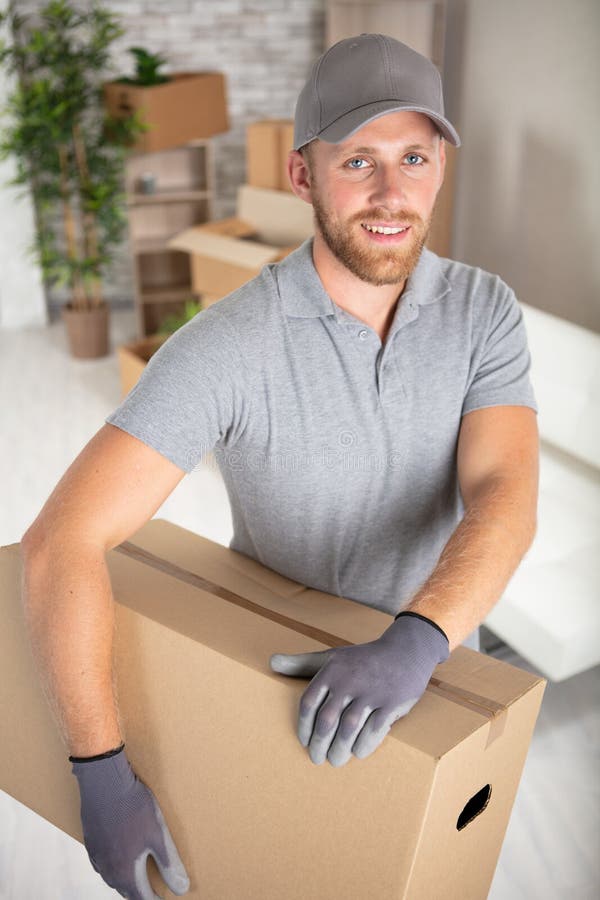 Image Happy Young Delivery Man with Parcel Stock Photo - Image of white ...