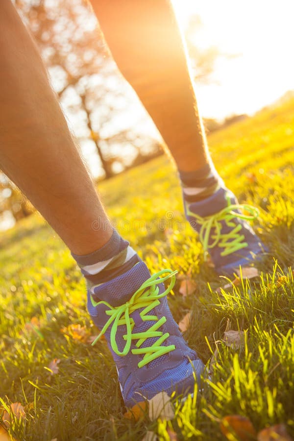 Image of Human Legs in Sportshoes Running Down Grass Stock Image ...