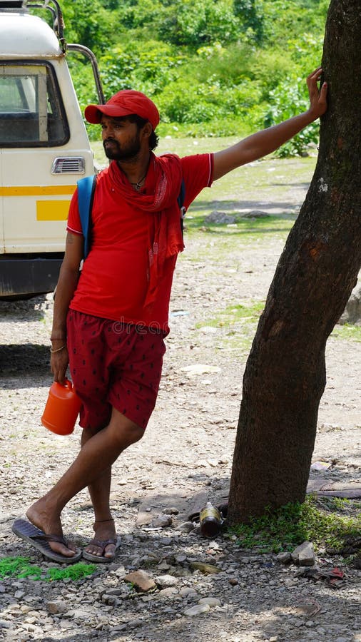 Image of Indian Man Resting Under Tree Editorial Image - Image of water ...