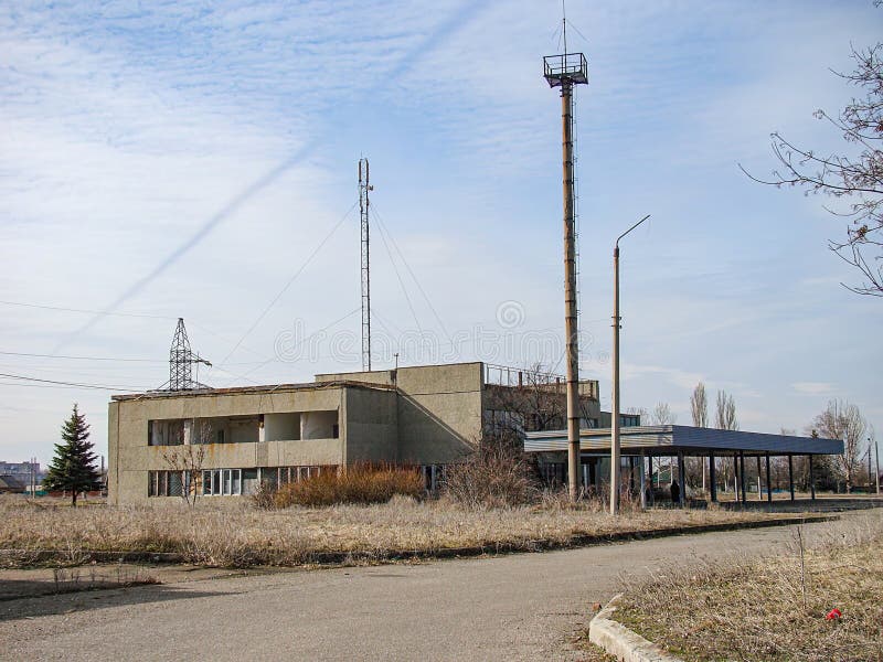 Image of an Industrial Building on Gravel Area, with a Tall Chimney and ...