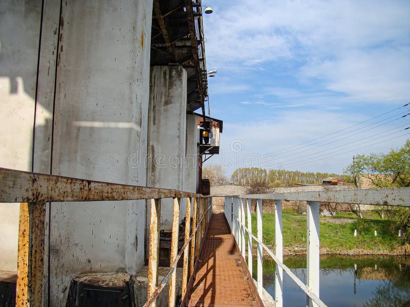 Image of an Industrial Structure by a Body of Water, Possibly a Docking ...