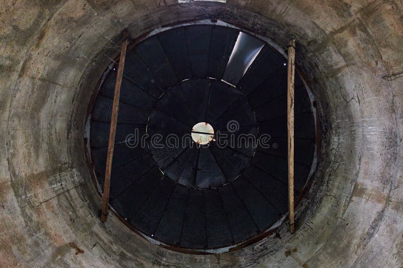 Interior of Concrete Silo with Black Camera Shutter Like Roof or ...