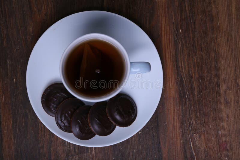 Image of Ivory Tea Cup with Sweet Heart Shaped Cookie Stock Image ...