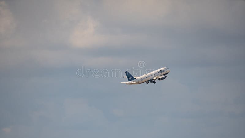 Image of a Jetblue Airplane Taking Off Departing into Sky Stock Photo ...