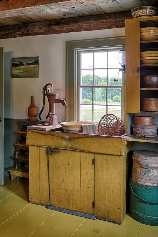 The Water Pump in a Primitive Colonial Style Kitchen Stock Image ...