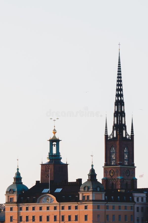 An Image of a Large Building in the Sun that Has a Clock Tower ...