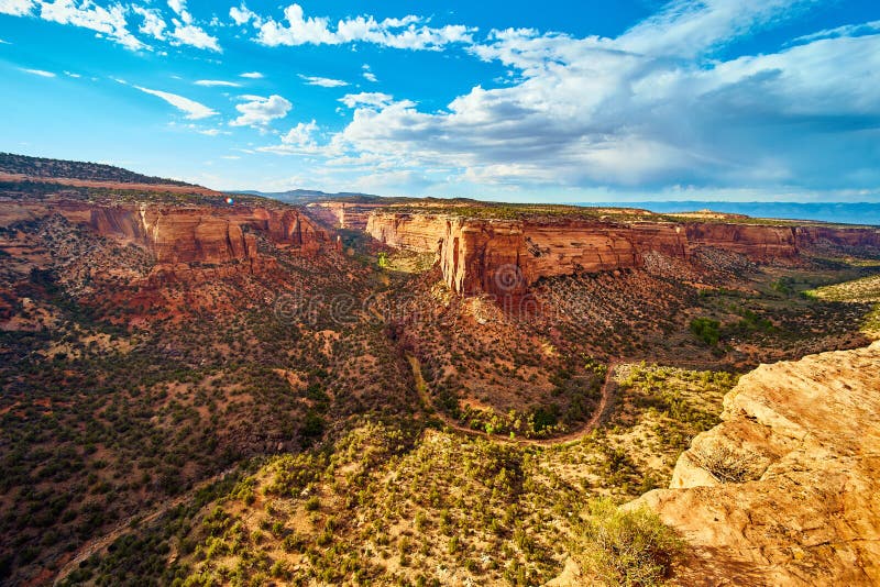 Large Open Canyon in Desert with Red Cliffs and Small River Stock Photo ...