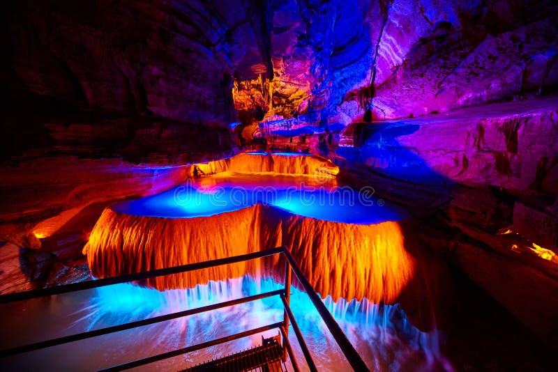 Large Underground Waterfall in Cave on Tour Path with Orange and Blue ...