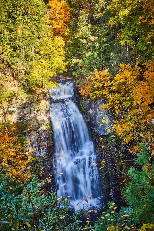 Large Waterfall Over Cliffs Surrounded by Fall Foliage Trees Stock ...
