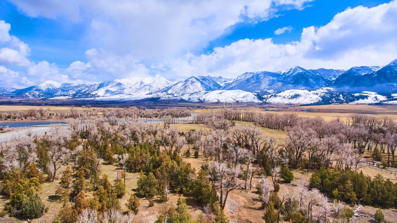 Late Winter Fields Surrounded by Huge Snowy Mountains Stock Image ...