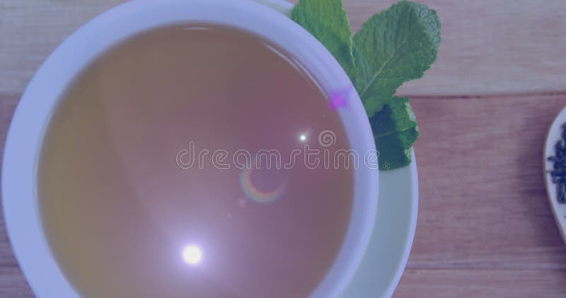 Image of Light Spots Over Cup of Tea on Table Stock Illustration ...