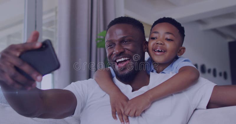 Image Of Lights Over Happy African American Father And Son Taking