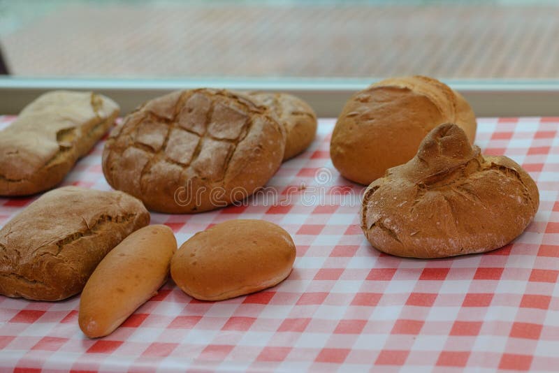 Loaves of Bread on a Checkered Tablecloth Stock Image - Image of bake ...