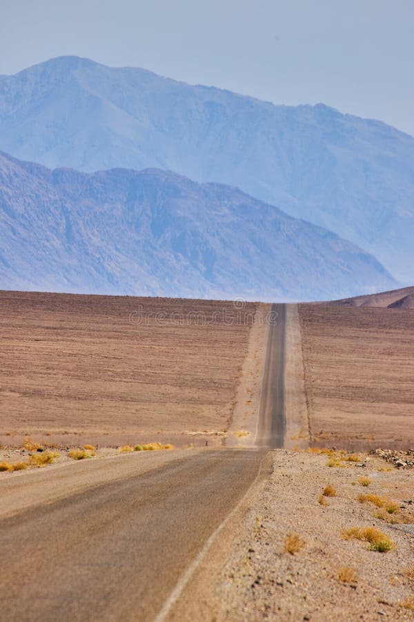 Long and Empty Desert Road in Empty Plains Leading To Large Mountains ...