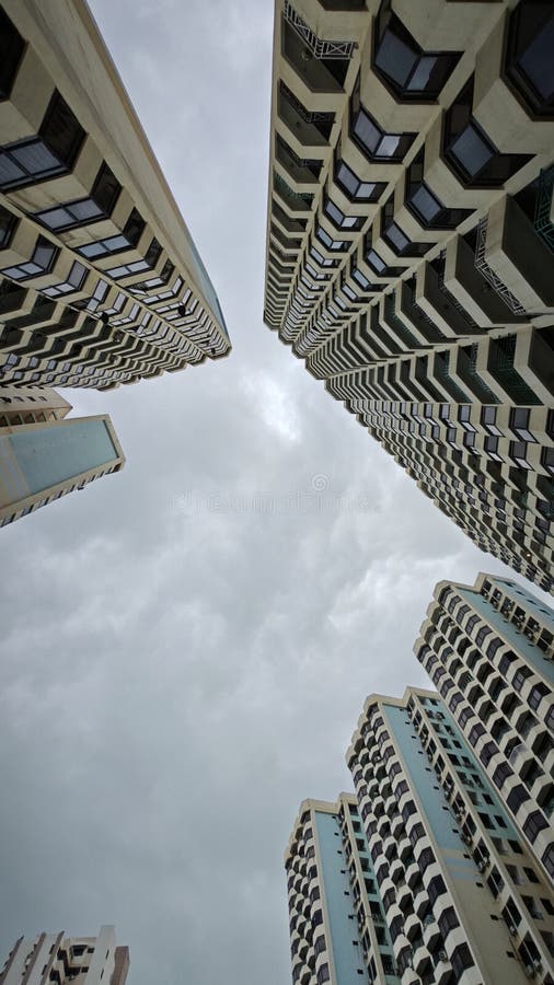 Looking Up the Daytime Blue Sky with the High Rise Building Balconies ...
