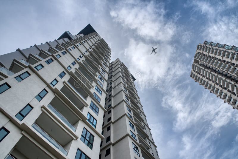 Looking Up the High Rise Urban Building with an Airplane Flying Over ...