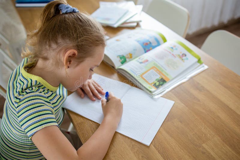 An Image of a Lovely Blonde Baby Who is Doing Her Homework, Using ...