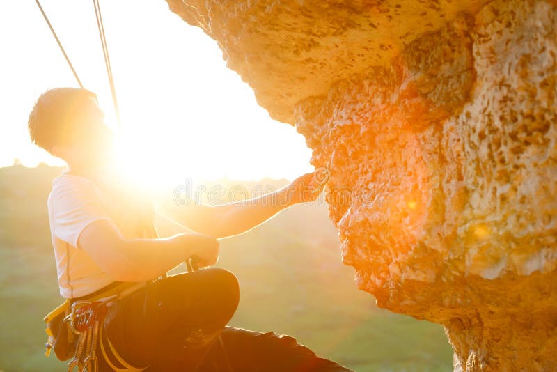 Image of Man Clambering Over Rock. Stock Image - Image of leisure ...