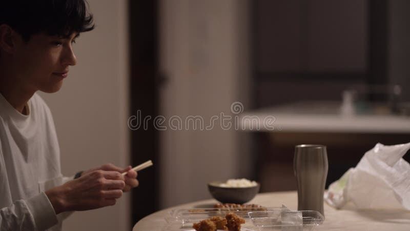 Man eating at home stock video. Video of food, delicious - 325183383