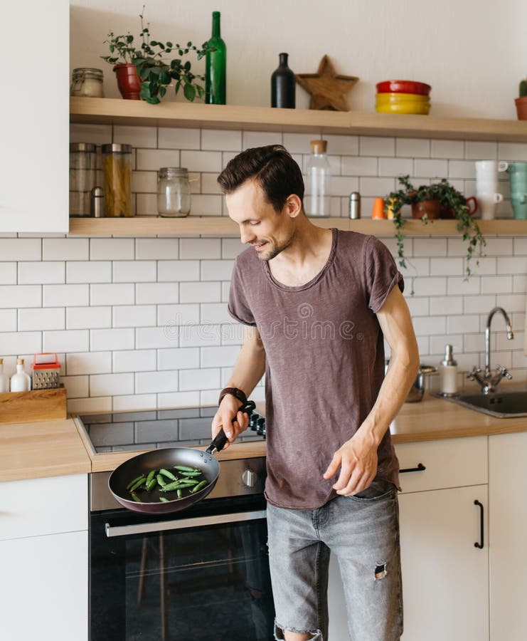 Image of Man with Frying Pan in Hands in Kitchen Stock Image - Image of ...