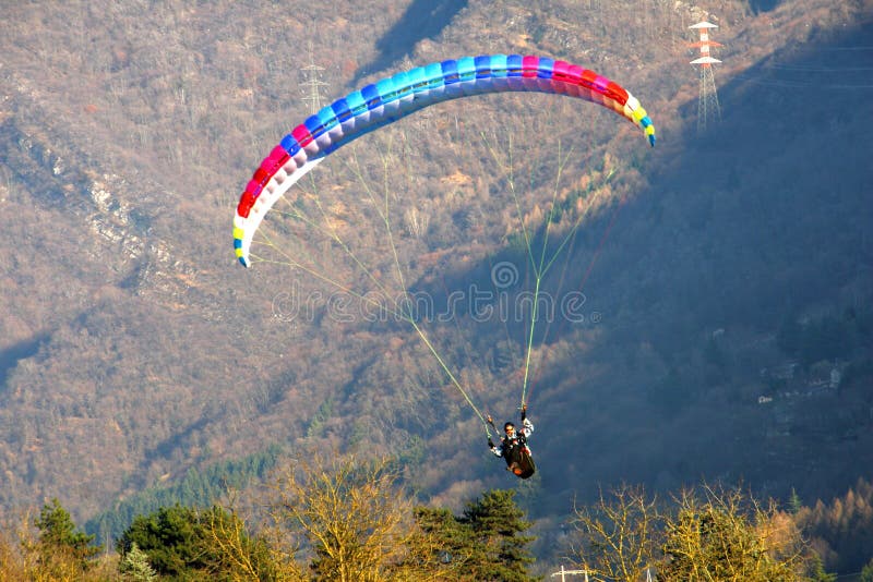 Image of Man Practicing Parachuting Over Mountain Landscape Stock Photo ...