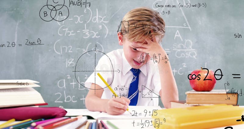 Image of Math Formulas Over Focused Caucasian Boy Doing Homework Stock ...
