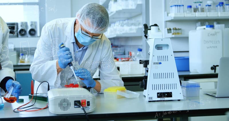 Image of Mathematical Equations Over Group of Diverse Scientists in Lab ...