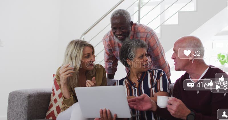 Image of Media Icons Over Diverse Group of Seniors Using Laptop Stock ...