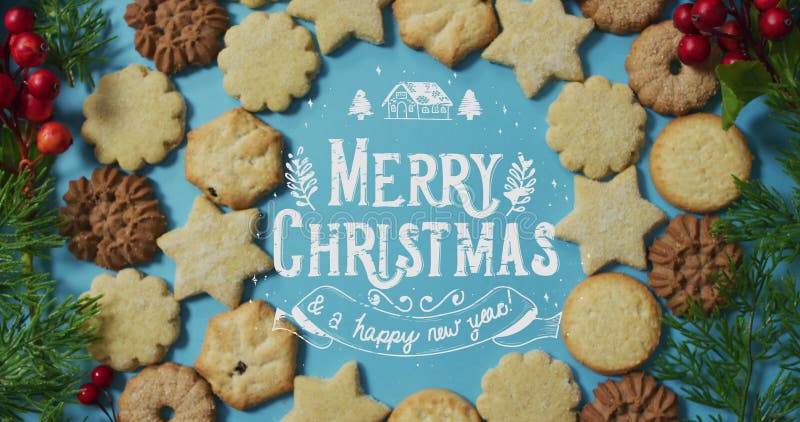 Image of Merry Christmas Over Cookies on Blue Surface Stock ...