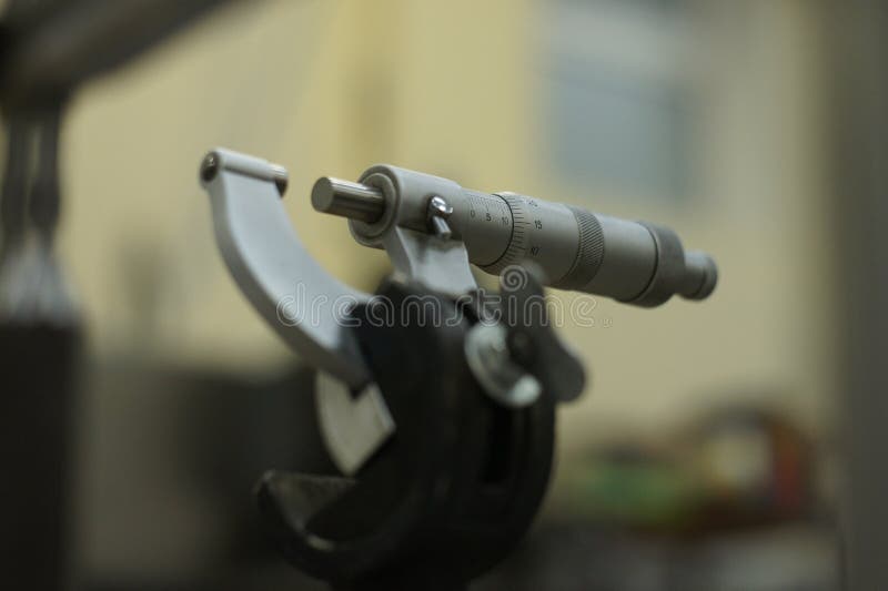 Image of a Metalworking Measuring Tool Mounted in a Rack. Micrometer ...